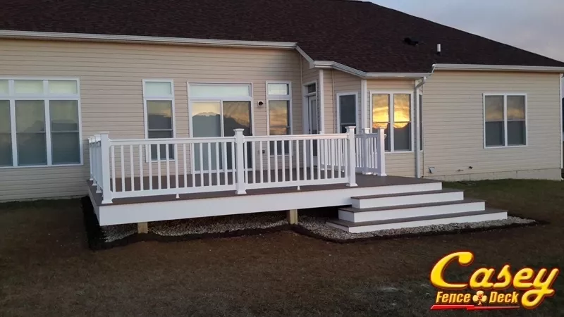 Ground Level Deck with Timbertech Composite and White Monument Railing